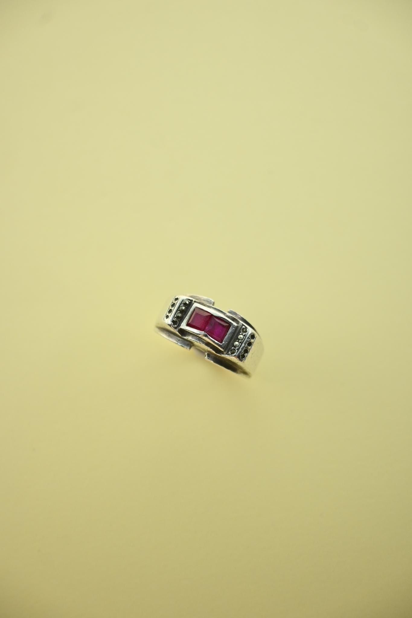 Silver tank ring set with marcasites and synthetic rubies.(S... | bids