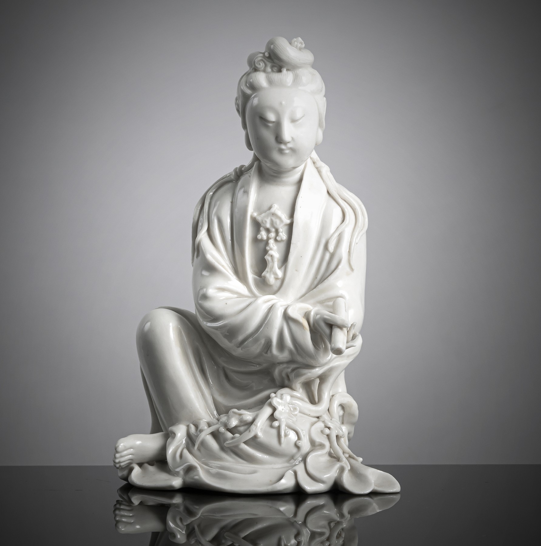 A fine Dehua figure of seated GuanyinChina, marked He Chaozo... | bids