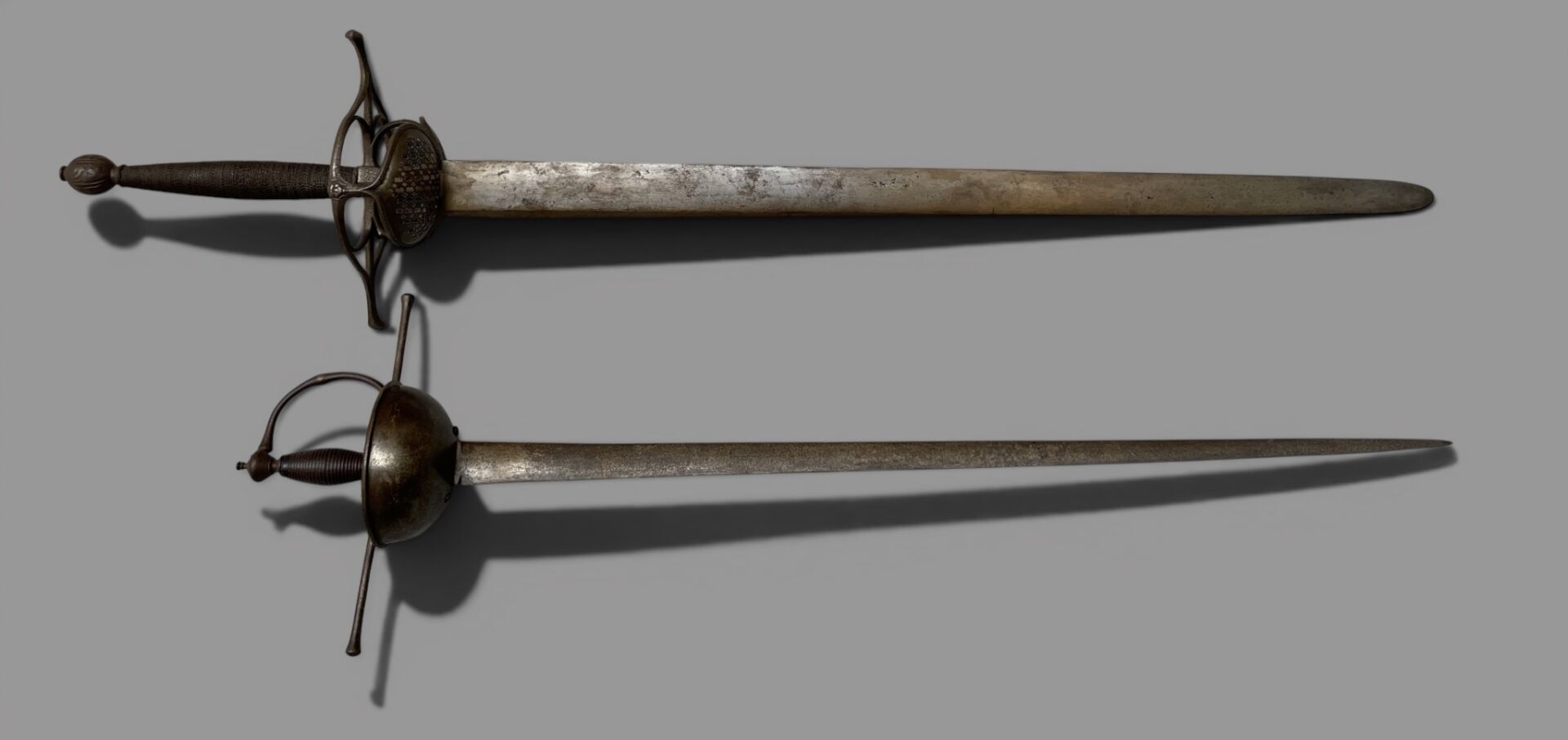Two swords in the 17th-century styleL: 108 cm and 124 cm | Arms: bids